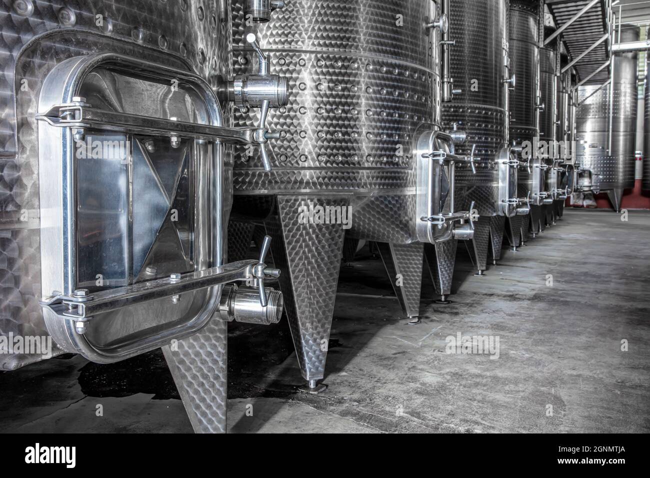 Steel wine tanks for wine fermentation at a winery. modern wine factory ...