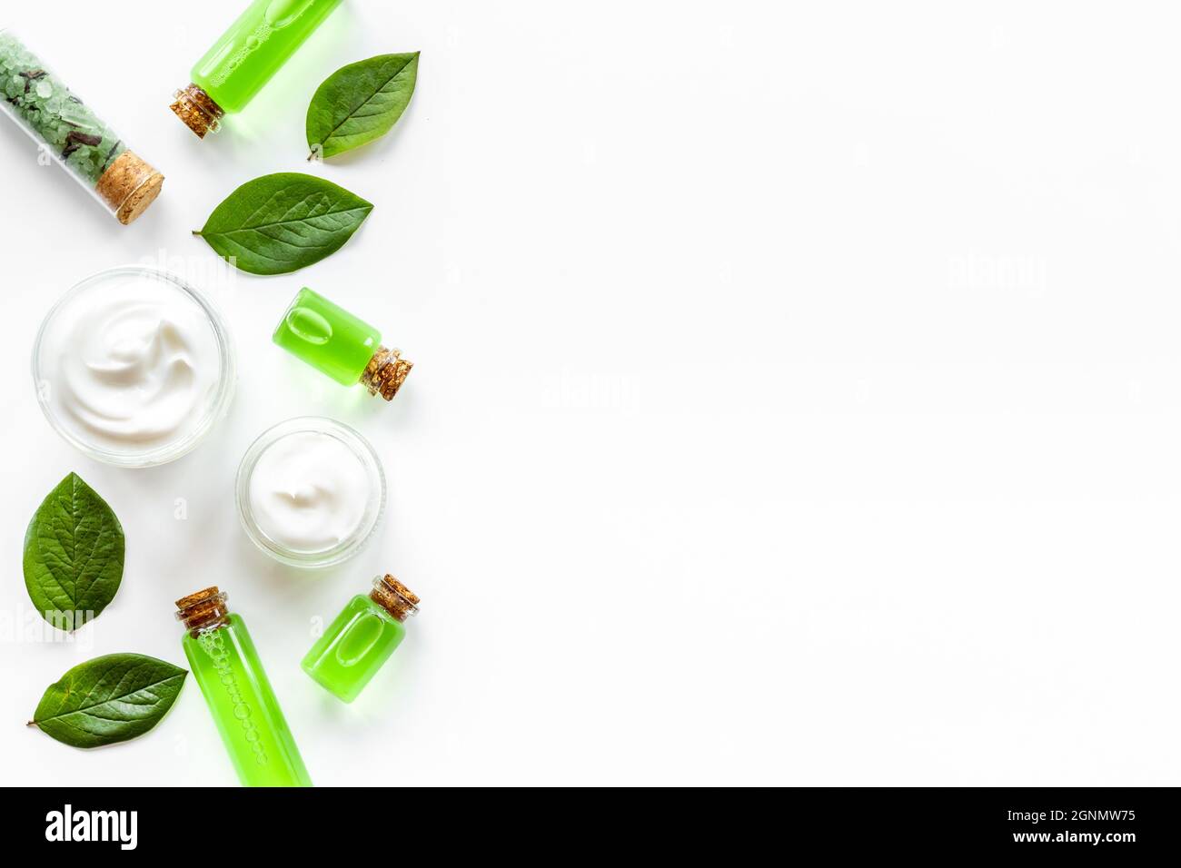 Layout of tea tree cosmetics with essential oil and salt with leaf ...