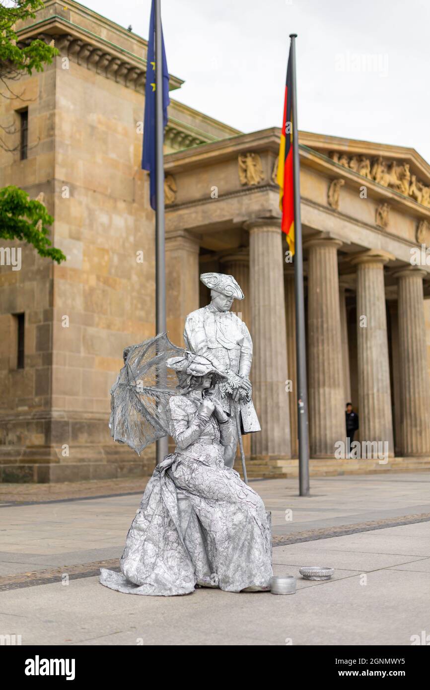 Art performance actors play statues on a city street. Berlin, Germany ...