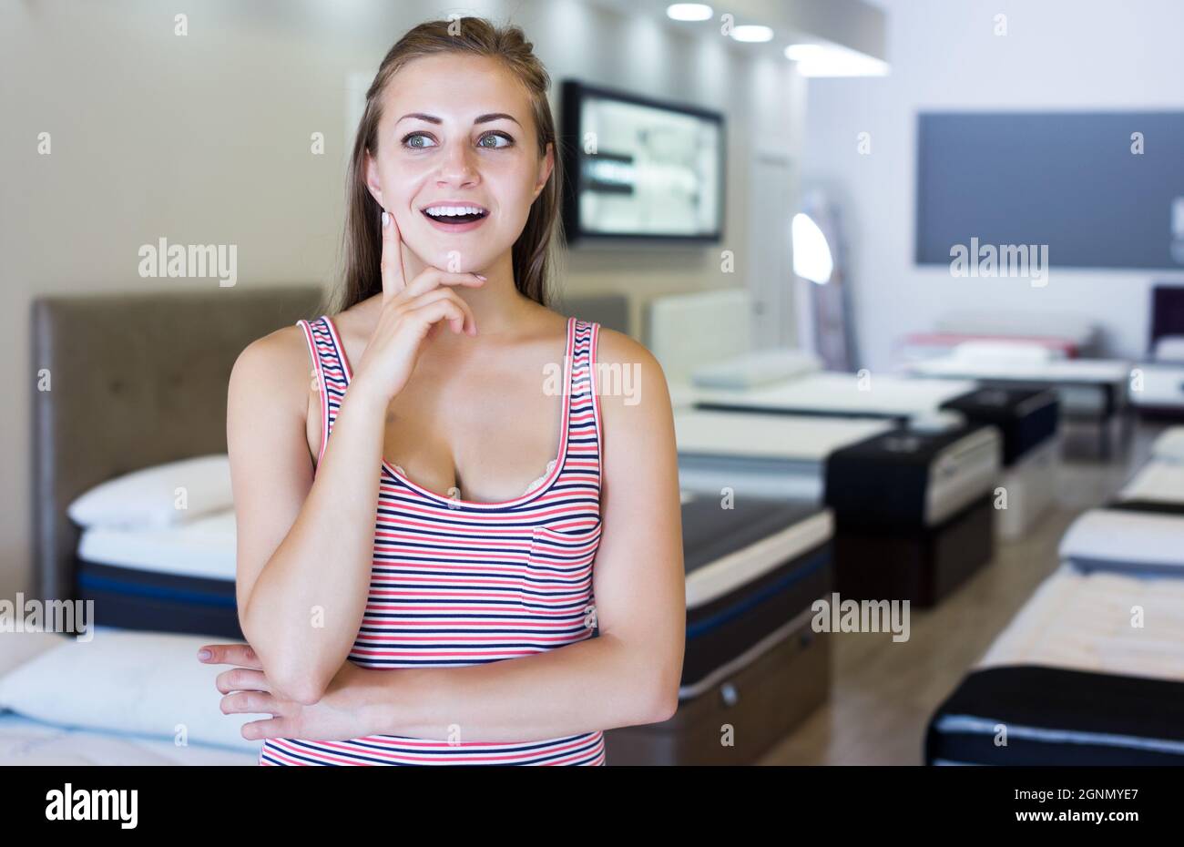 Female customer in mattresses store Stock Photo - Alamy