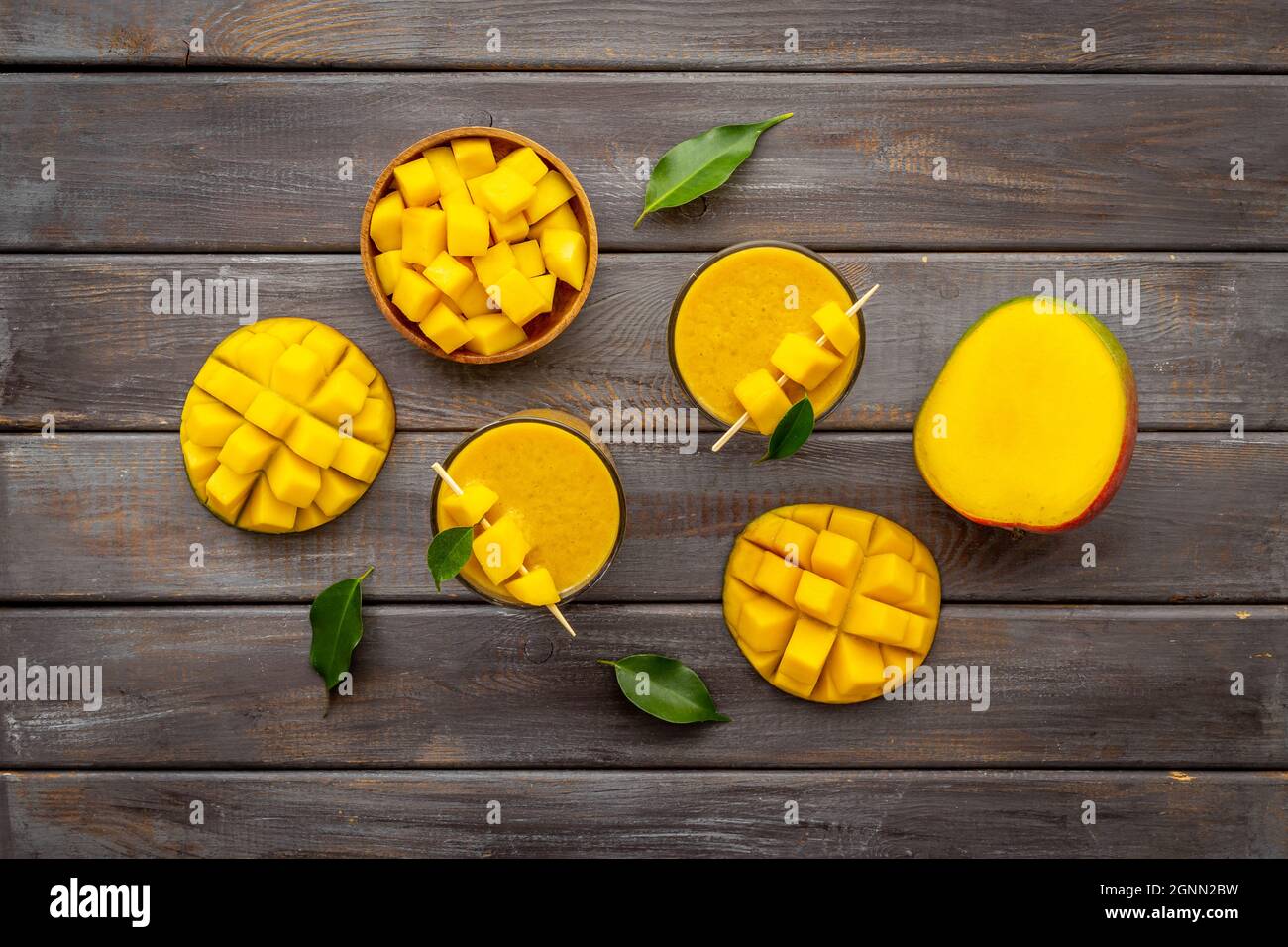 Top view of mango slices and cubes with fresh mango smoothie Stock ...