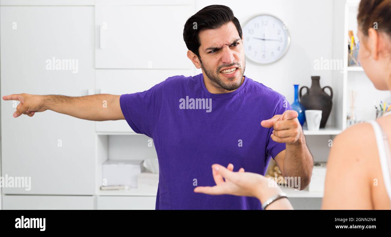 Disgruntled man quarreling with girlfriend Stock Photo - Alamy