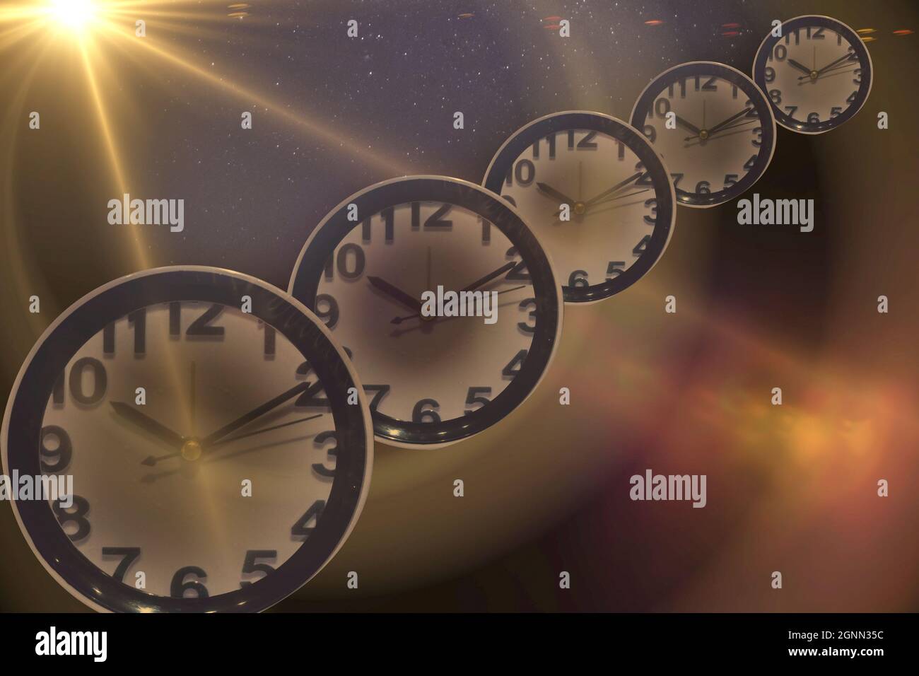 Clocks aligned diagonally on a background representing space and a ...