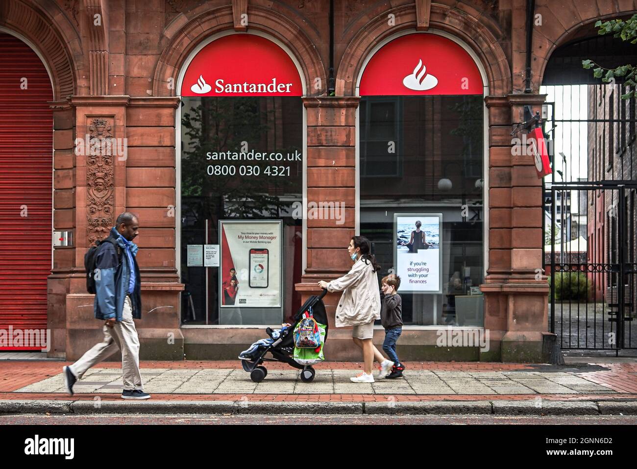 People walk by Santander Bank on Royal Avenue, Belfast Stock Photo - Alamy