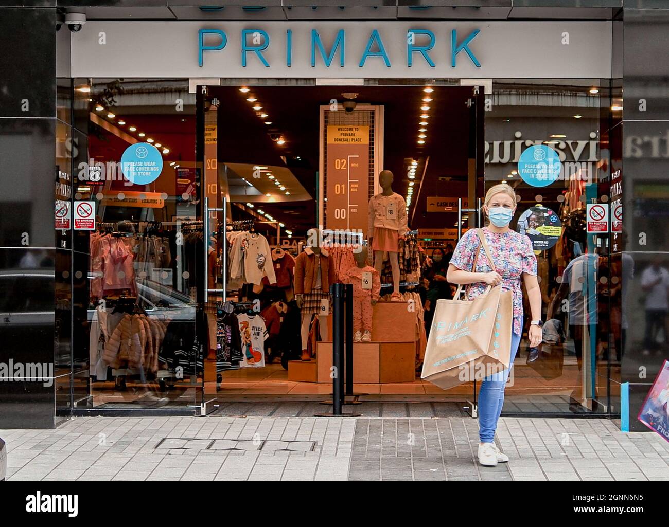 A shopper seen exiting Primark Clothing store on Donegall Place ...