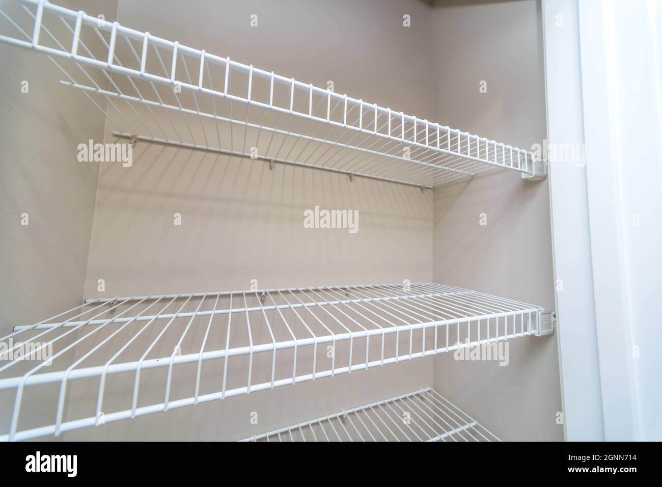 Empty wire shelving storage in an empty closet Stock Photo - Alamy
