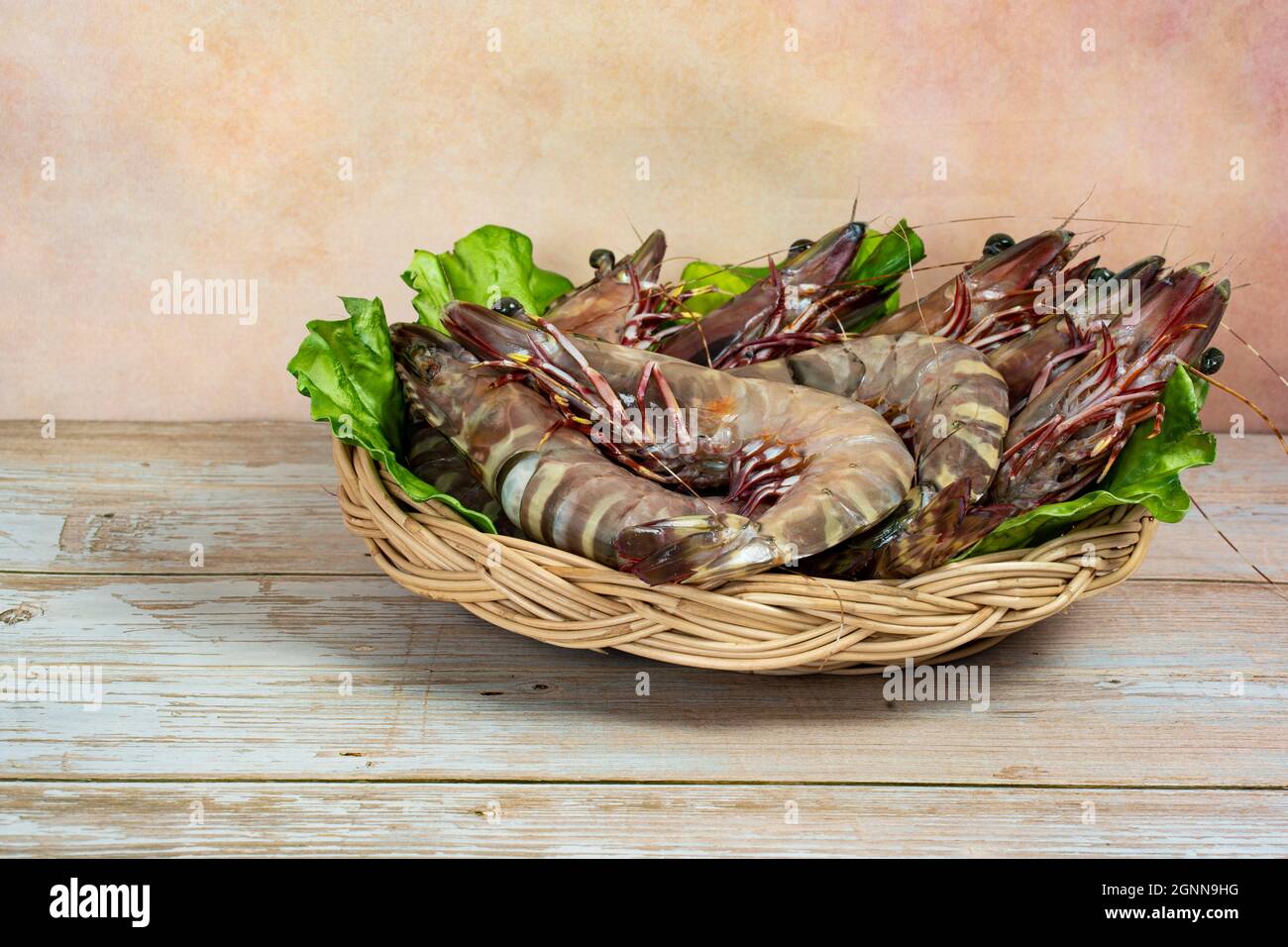 Fresh giant tiger prawns in a basket. Tiger prawn widely reared for ...