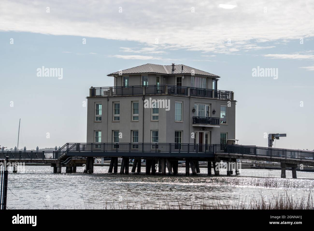 A large building built on stilts for hurricane flood protection Stock ...