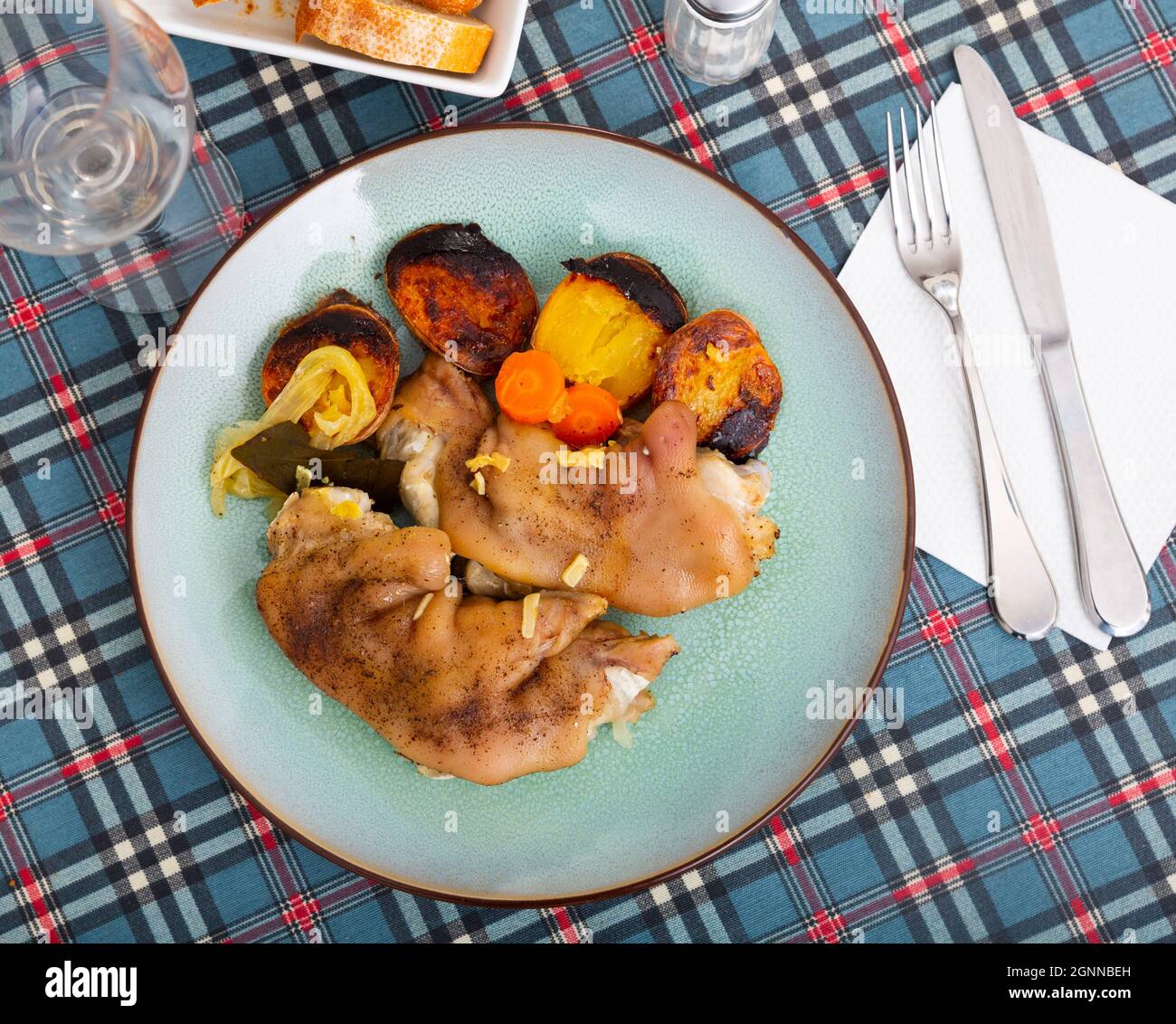 Stewed pig trotters with potato, homemade dinner Stock Photo - Alamy