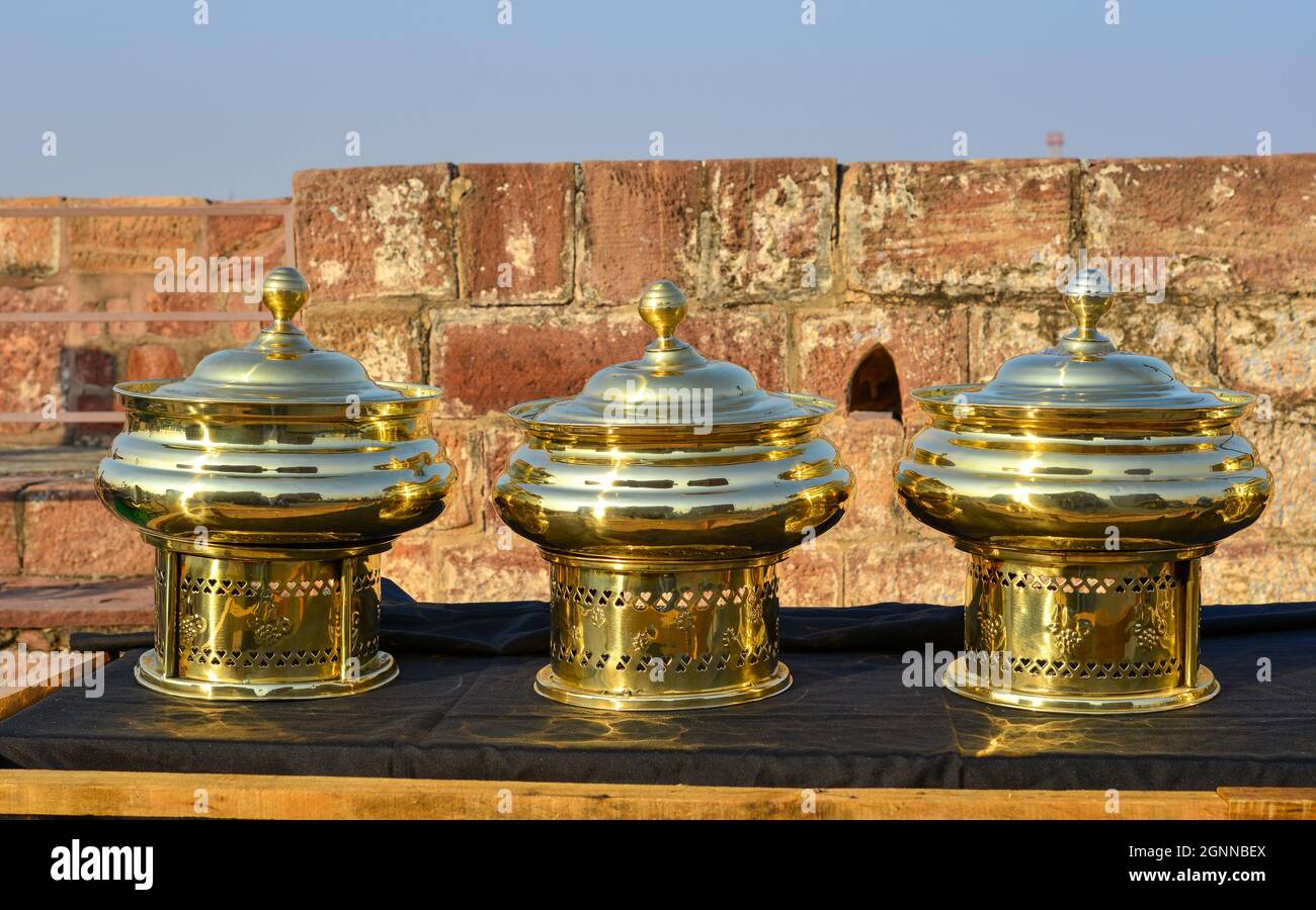 Golden food trays at outdoor buffet of luxury restaurant in New Delhi ...