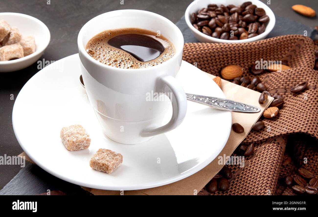 Coffee with snacks on black background. Table setting Stock Photo - Alamy