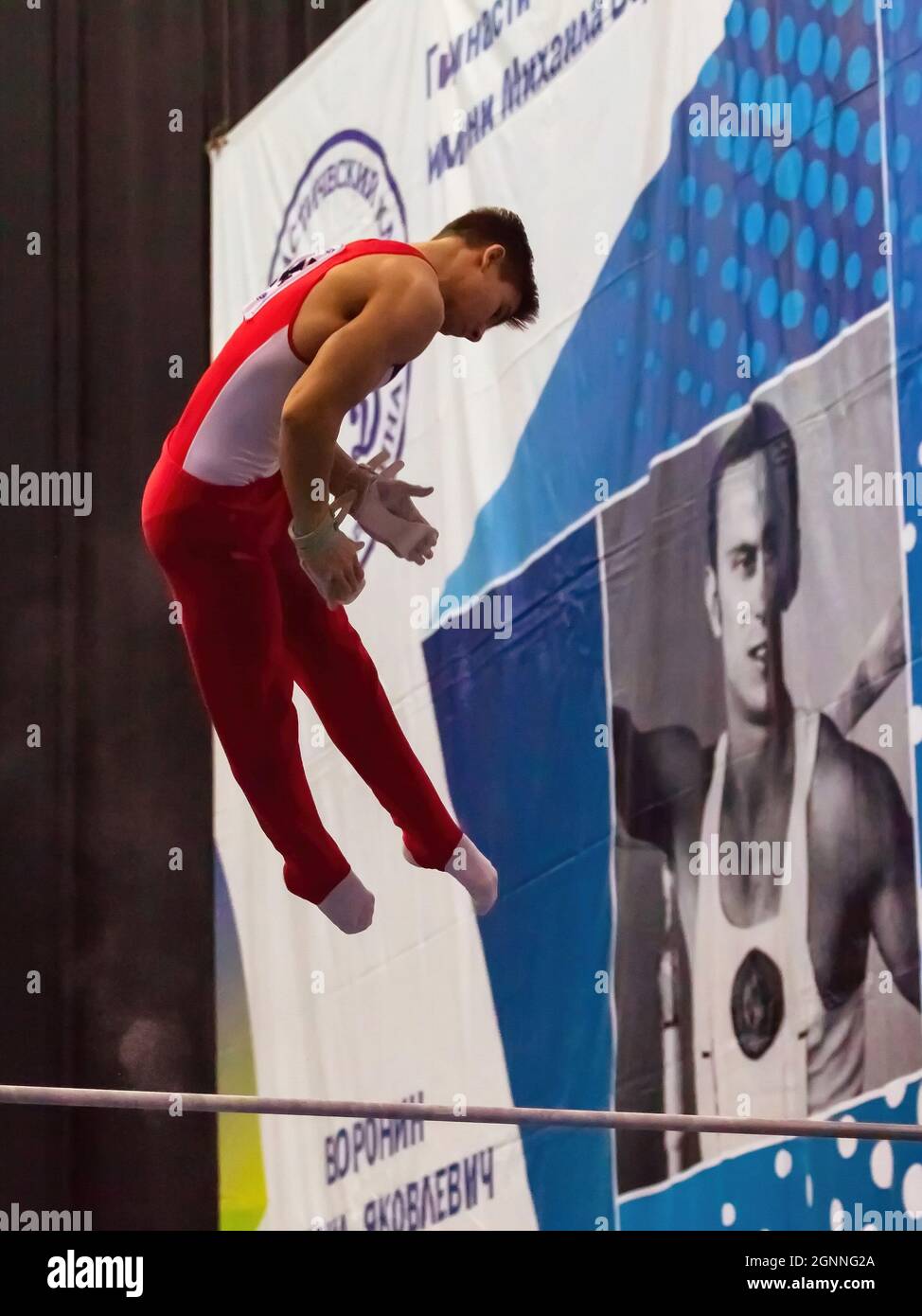 Russian gymnast performs on the bar during the event. The XXV ...
