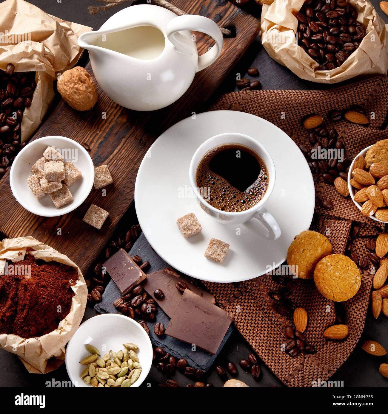 Coffee with snacks on black background. Table setting. Top view, flat ...
