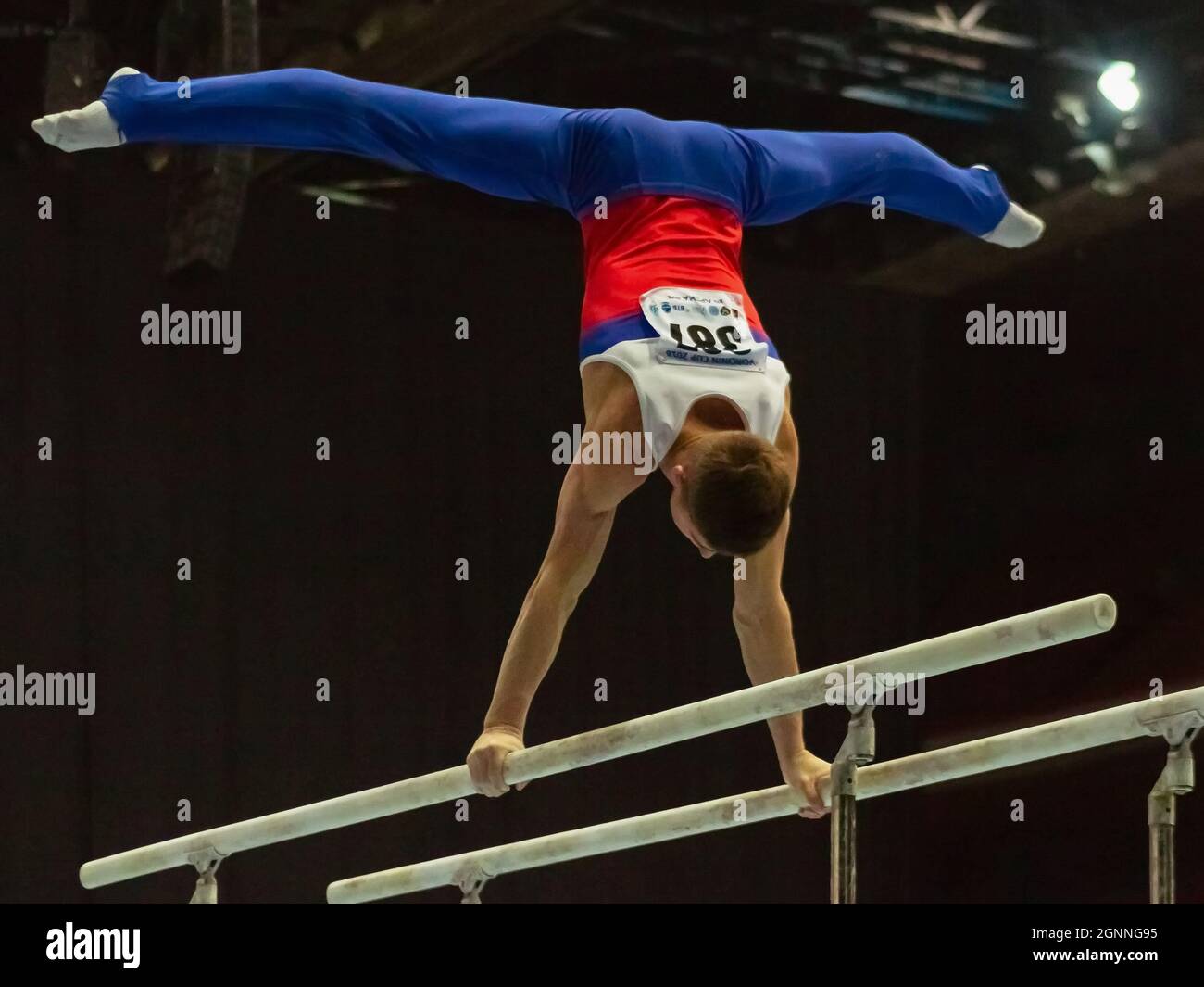 Russian gymnast on the uneven bars during the event. The XXV ...