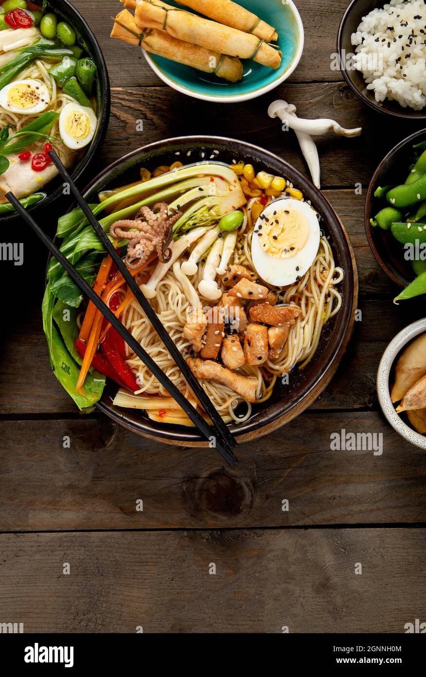 Asian dishes and snacks on wooden background. Traditional food concept ...