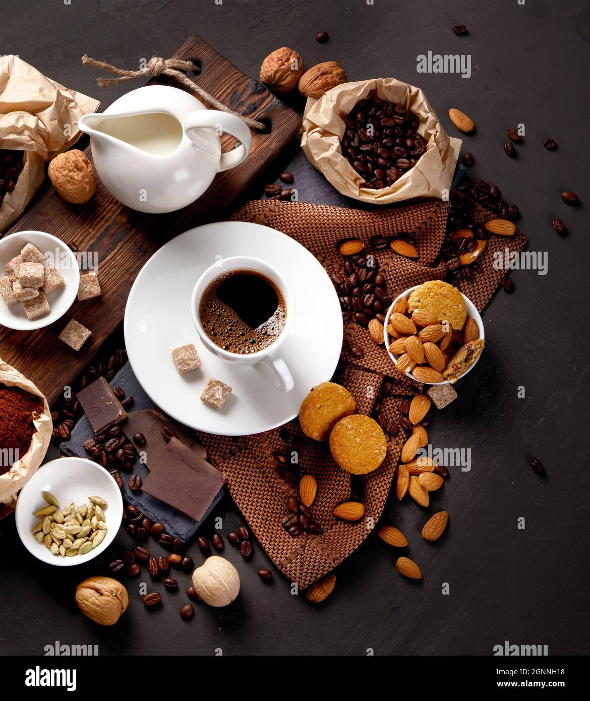 Coffee with snacks on black background. Table setting. Top view, flat ...