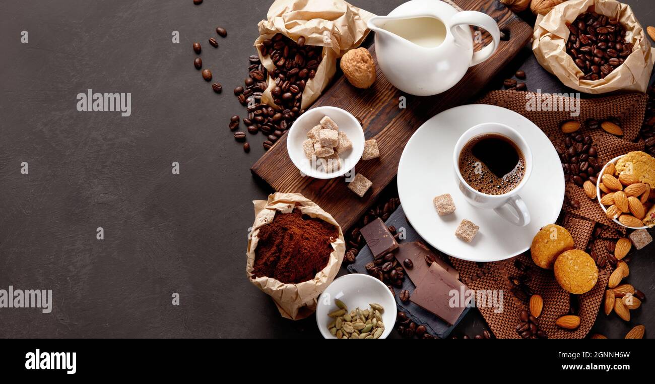Coffee with snacks on black background. Table setting. Top view, flat ...