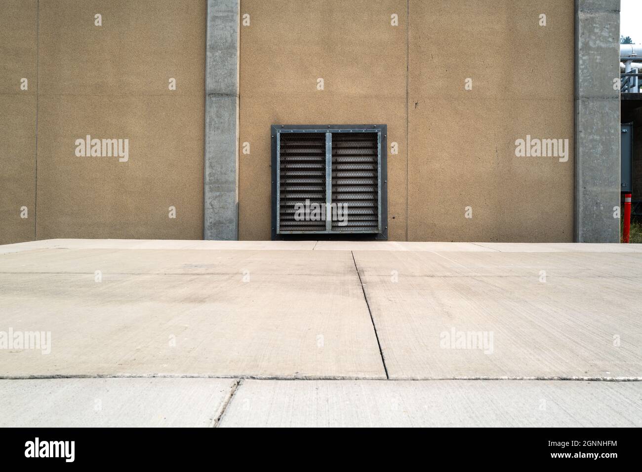 An air vent in the wall of a concrete building Stock Photo - Alamy