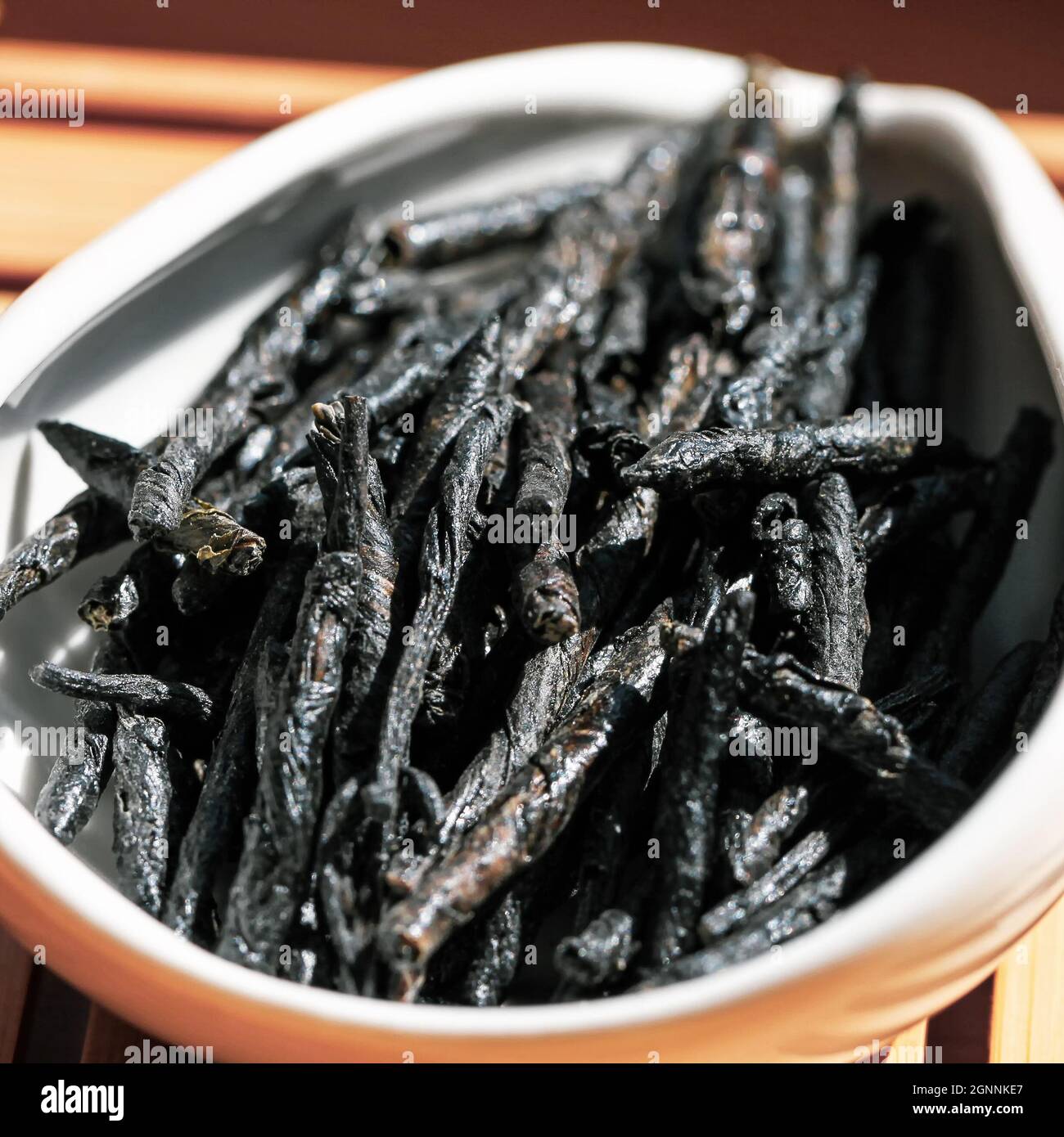 Chinese tea drink Kuding or kuzding in tea presentation vessel, macro ...