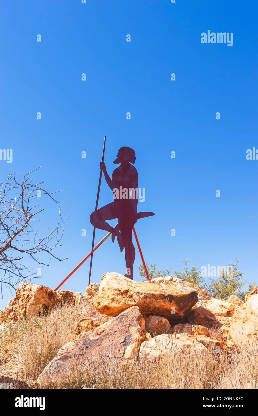 Vertical view of a metal statue of an Aboriginal silhouette, Cue ...