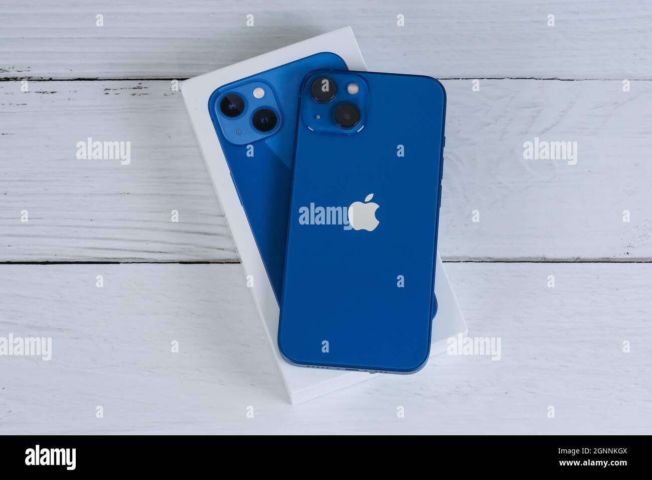 iPhone 13 in blue Stock Photo - Alamy
