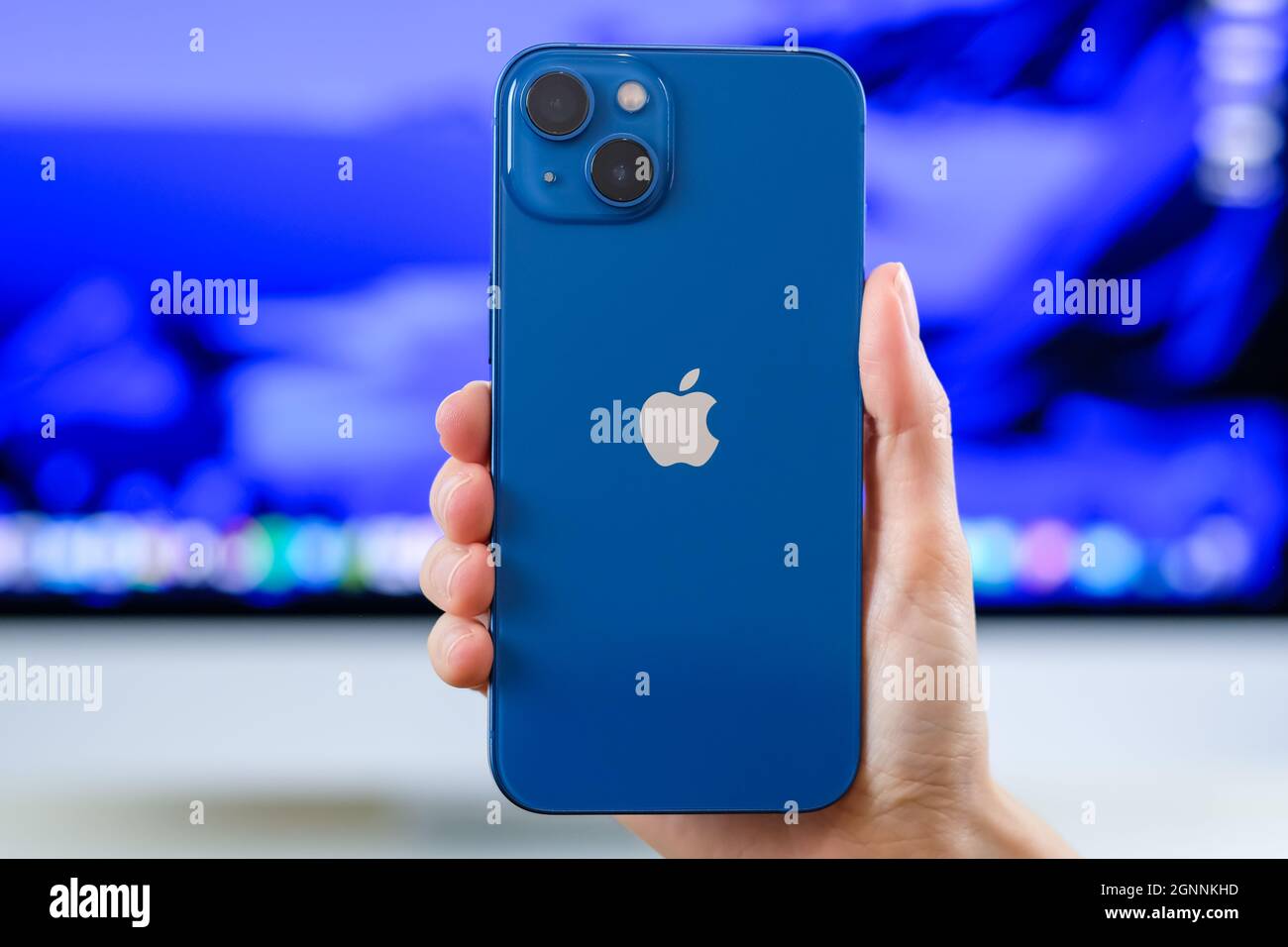 iPhone 13 in blue Stock Photo - Alamy