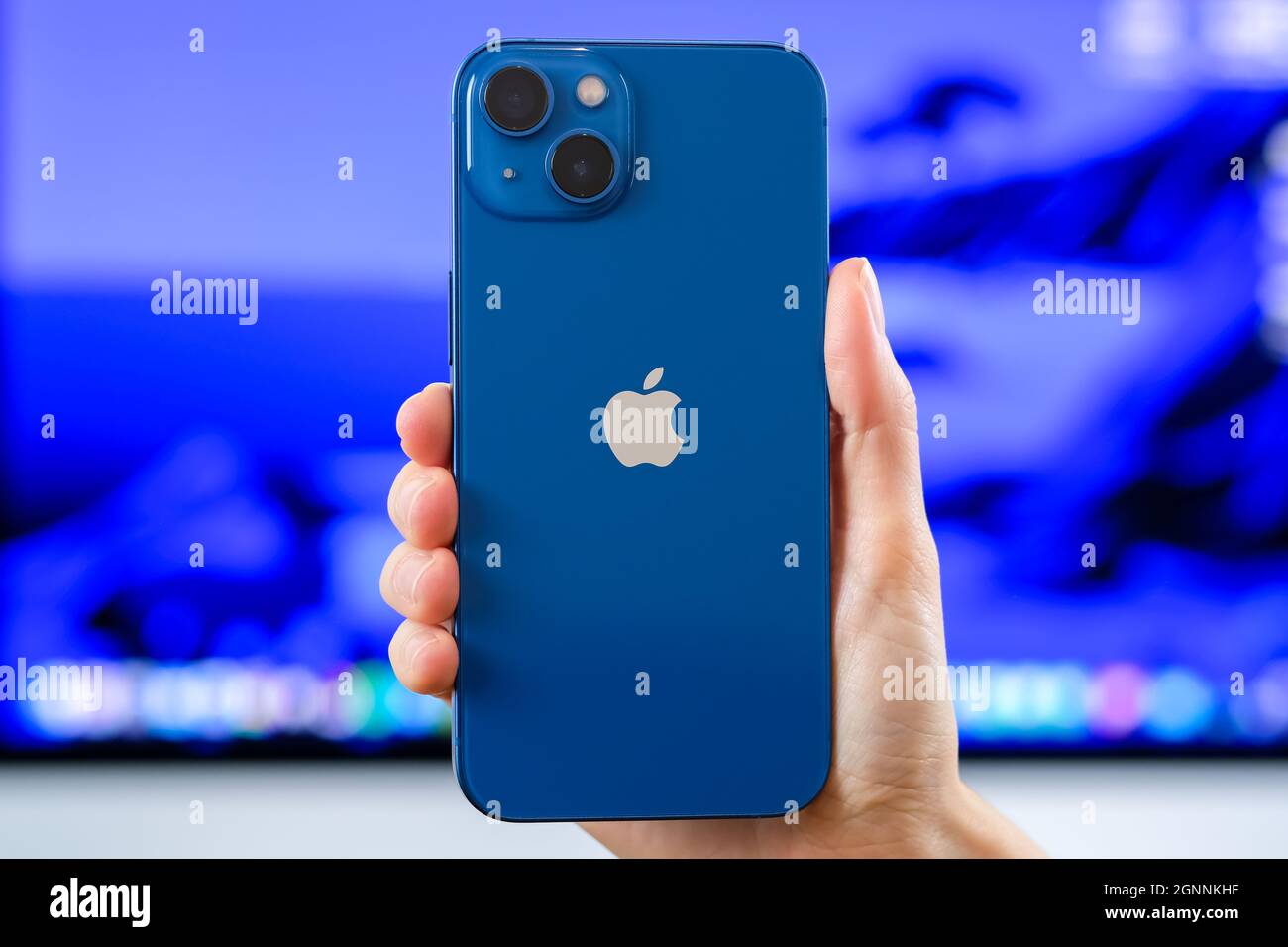 iPhone 13 in blue Stock Photo - Alamy