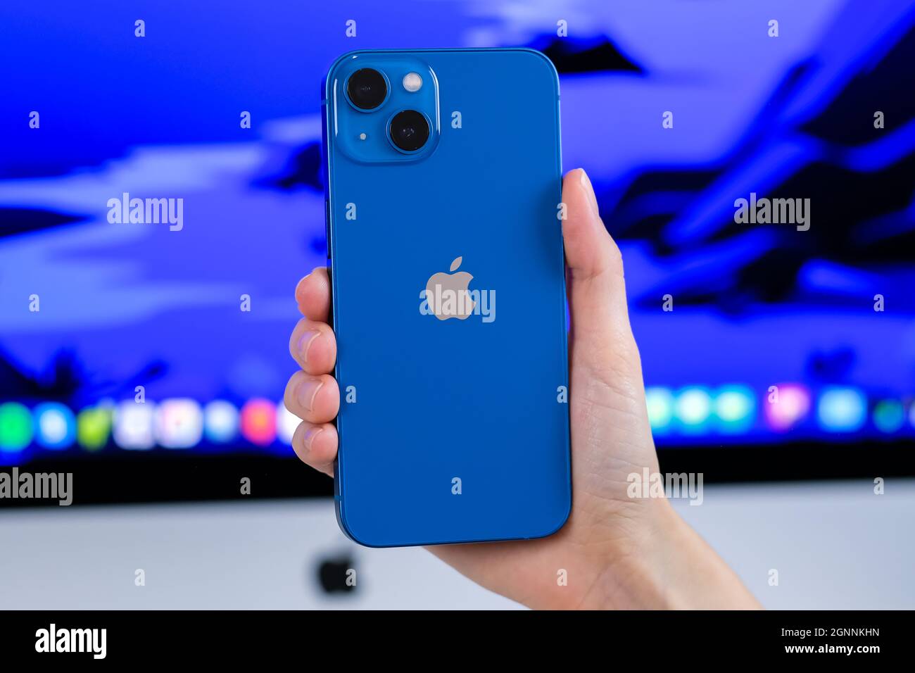 iPhone 13 in blue Stock Photo - Alamy