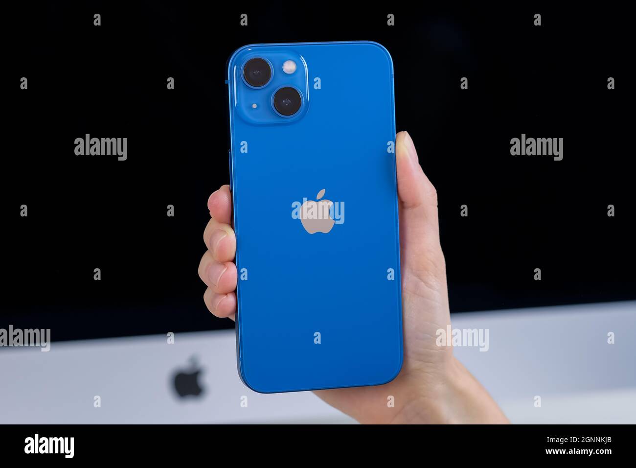 iPhone 13 in blue Stock Photo - Alamy