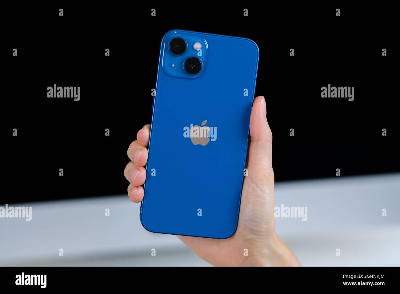 iPhone 13 in blue Stock Photo - Alamy