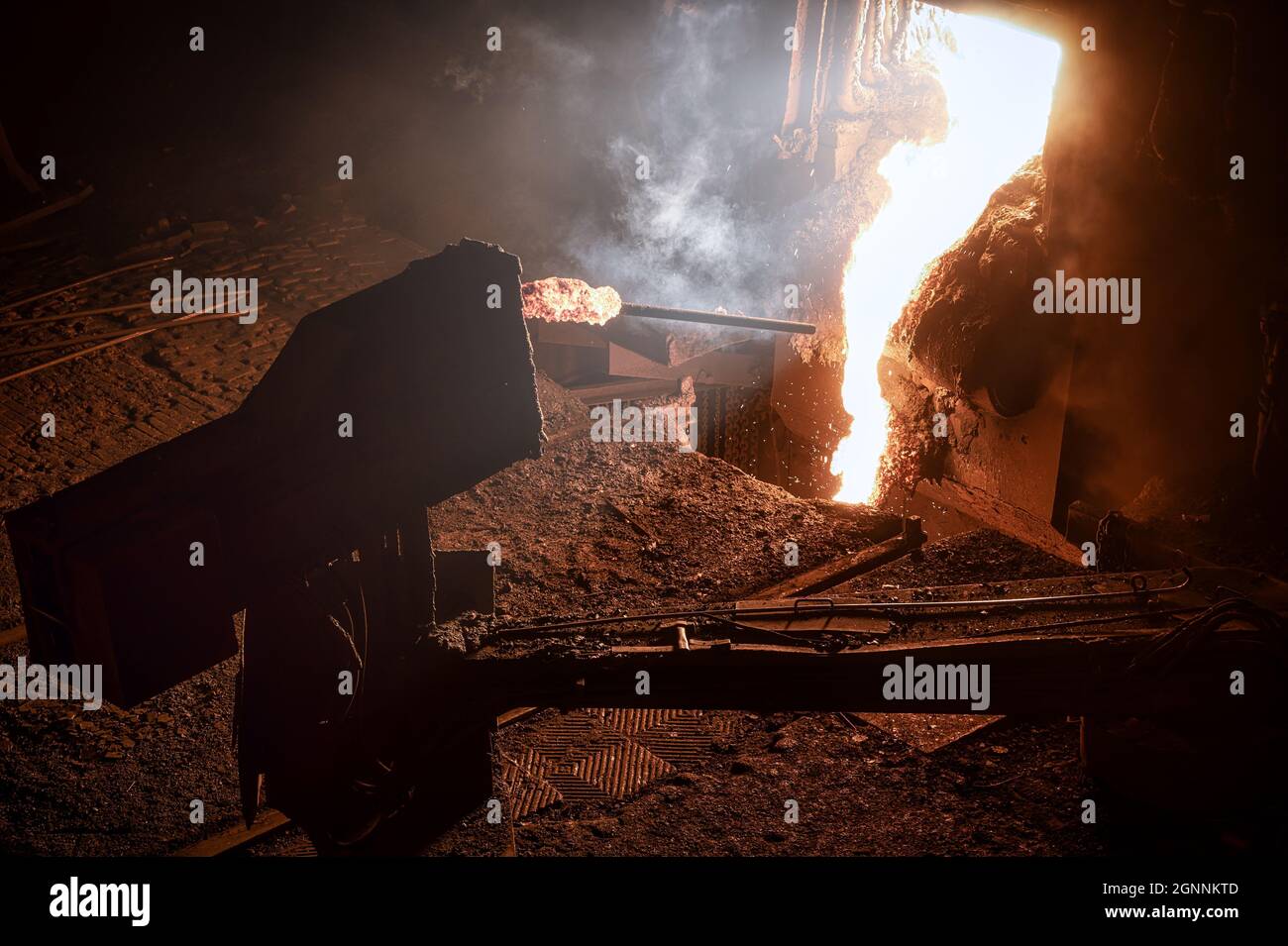 Automatic sampler. The process of taking a sample of liquid metal in a ...