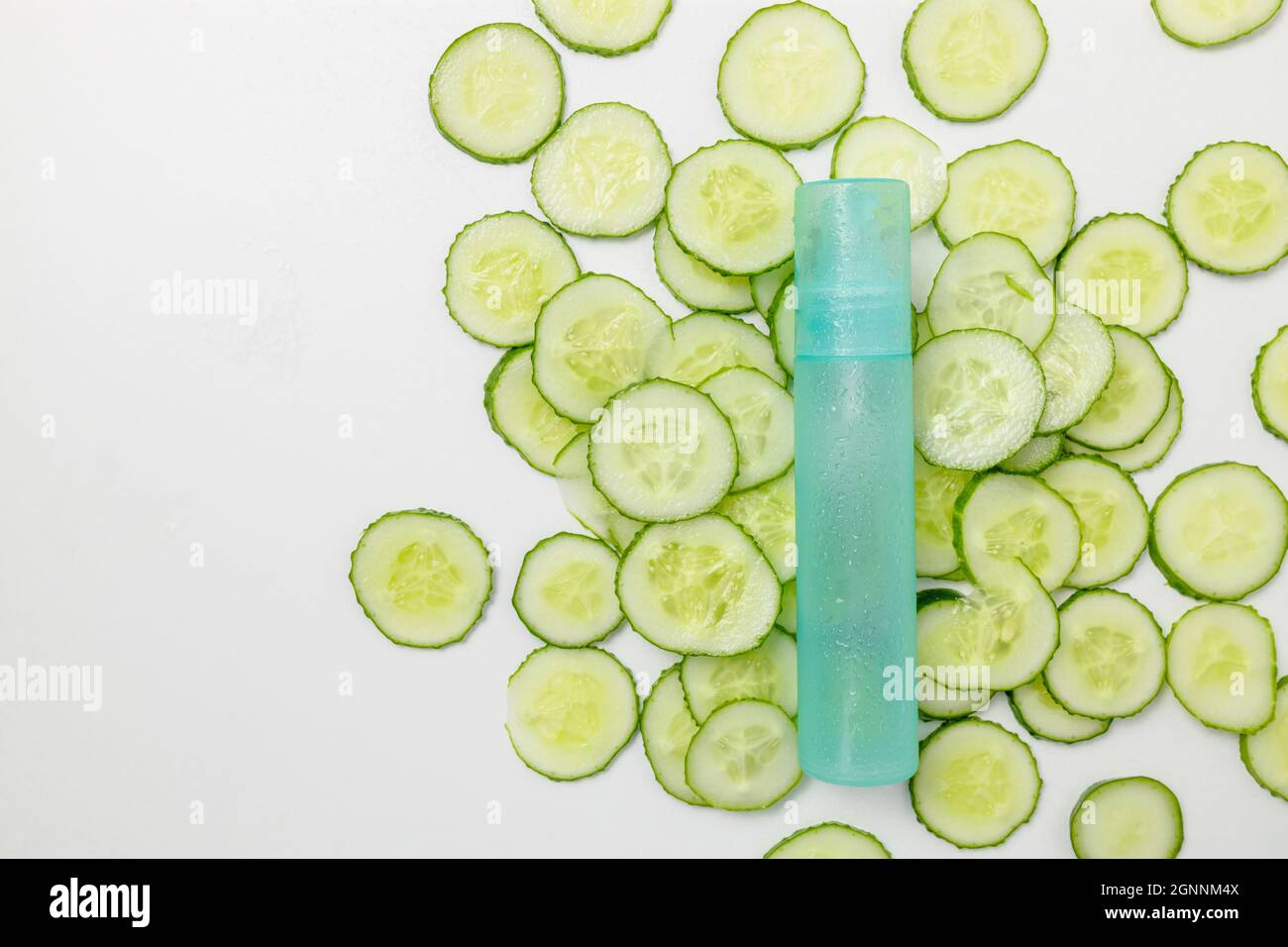 Flat lay composition with natural facial liquid lotion with cucumber ...