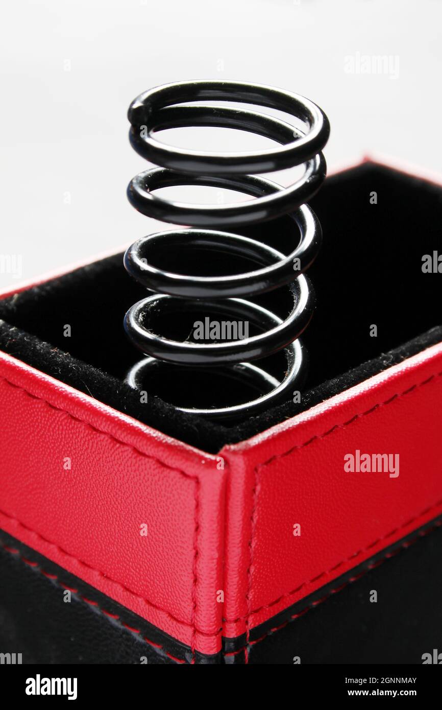Metal spring stretching hi-res stock photography and images - Alamy