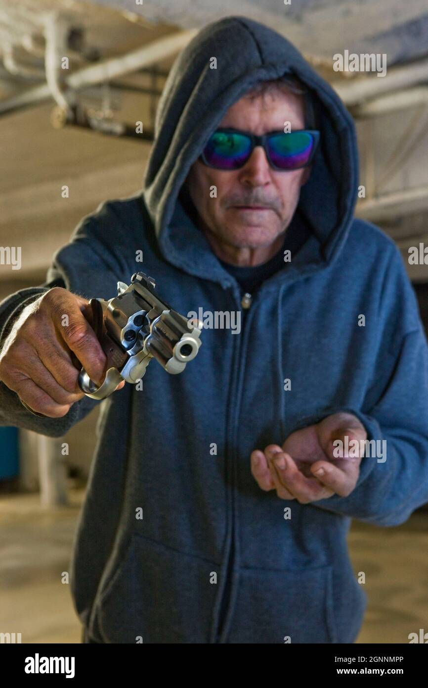 Mugger w revolver carport 6 MR - Model Released Stock Photo - Alamy