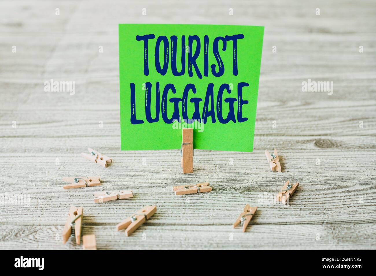 Conceptual caption Tourist Luggage. Word Written on big bag that ...