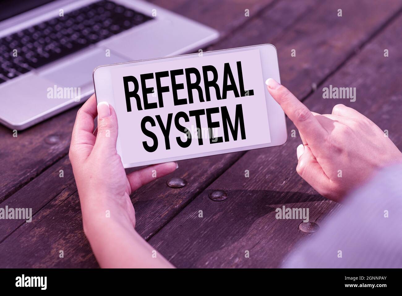Hand writing sign Referral System. Concept meaning sending own patient ...