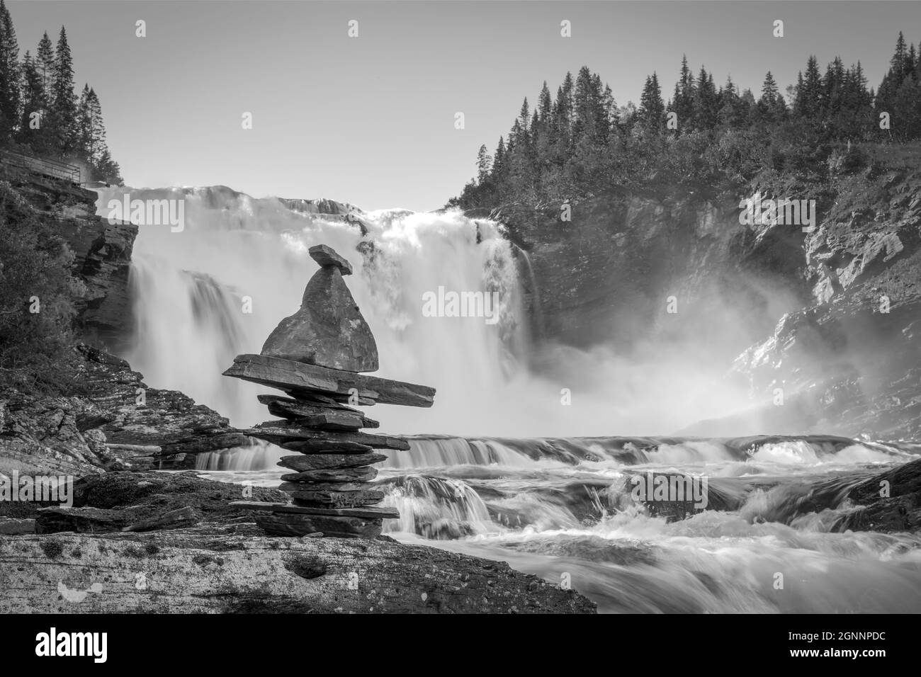 statue of stones with waterfall Stock Photo - Alamy