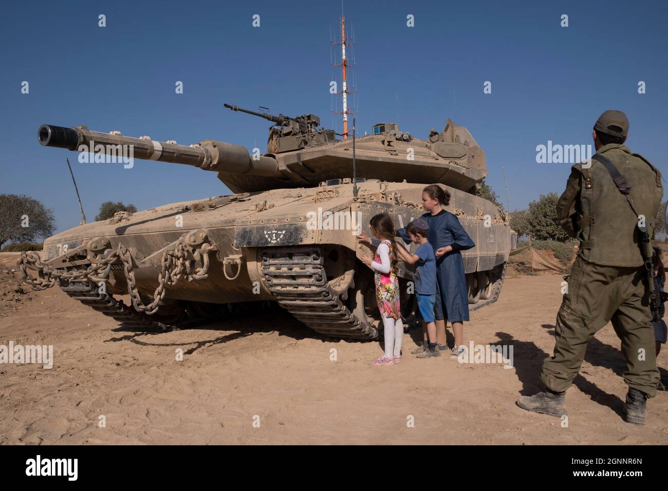 GAZA BORDER, ISRAEL - SEPTEMBER 26: An Israeli soldier explains to ...