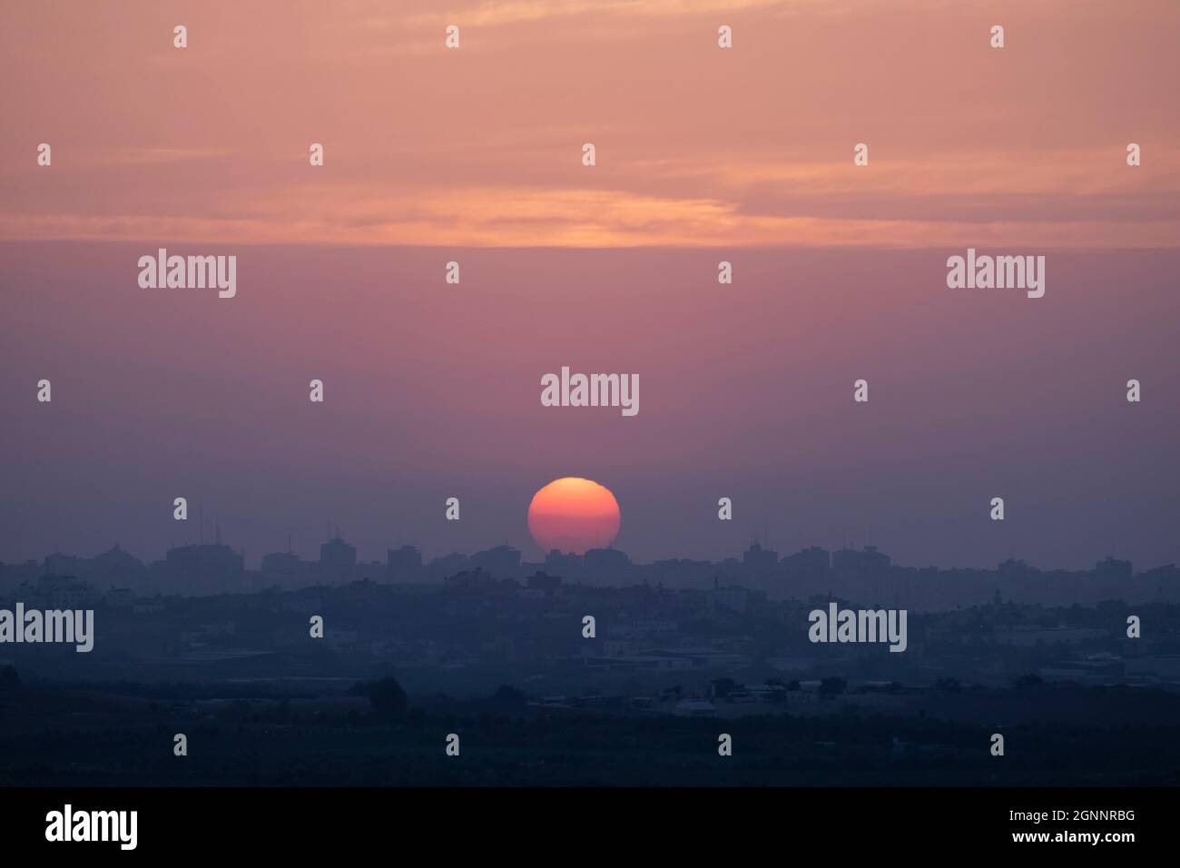 Sunset over Gaza City as it seen from Israeli side of the border with ...