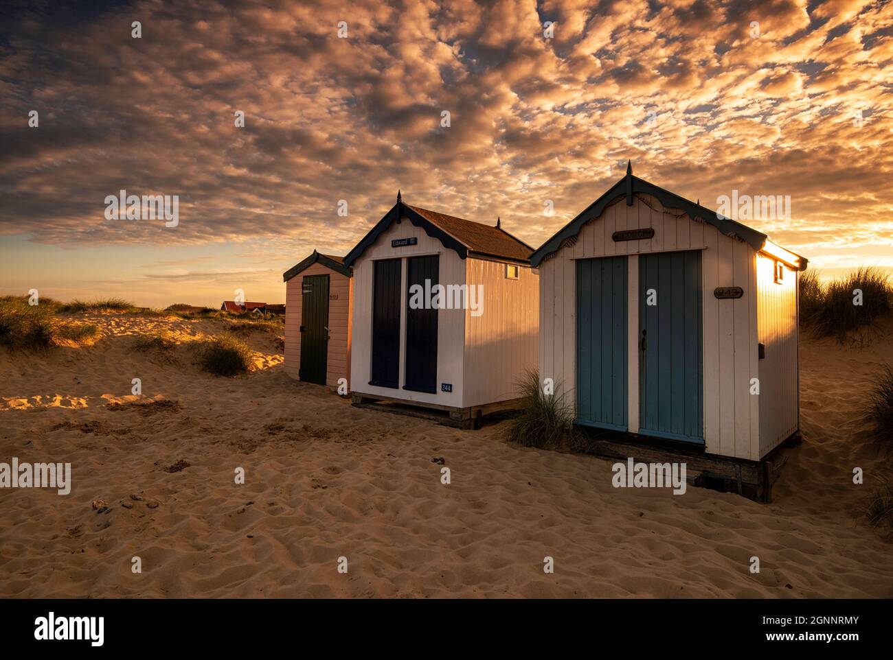 Sunset over the beach huts at Southwold, Suffolk England UK Stock Photo ...