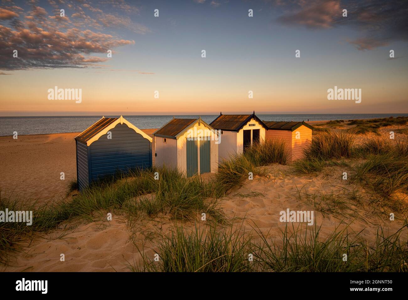 Sunset over the beach huts at Southwold, Suffolk England UK Stock Photo ...