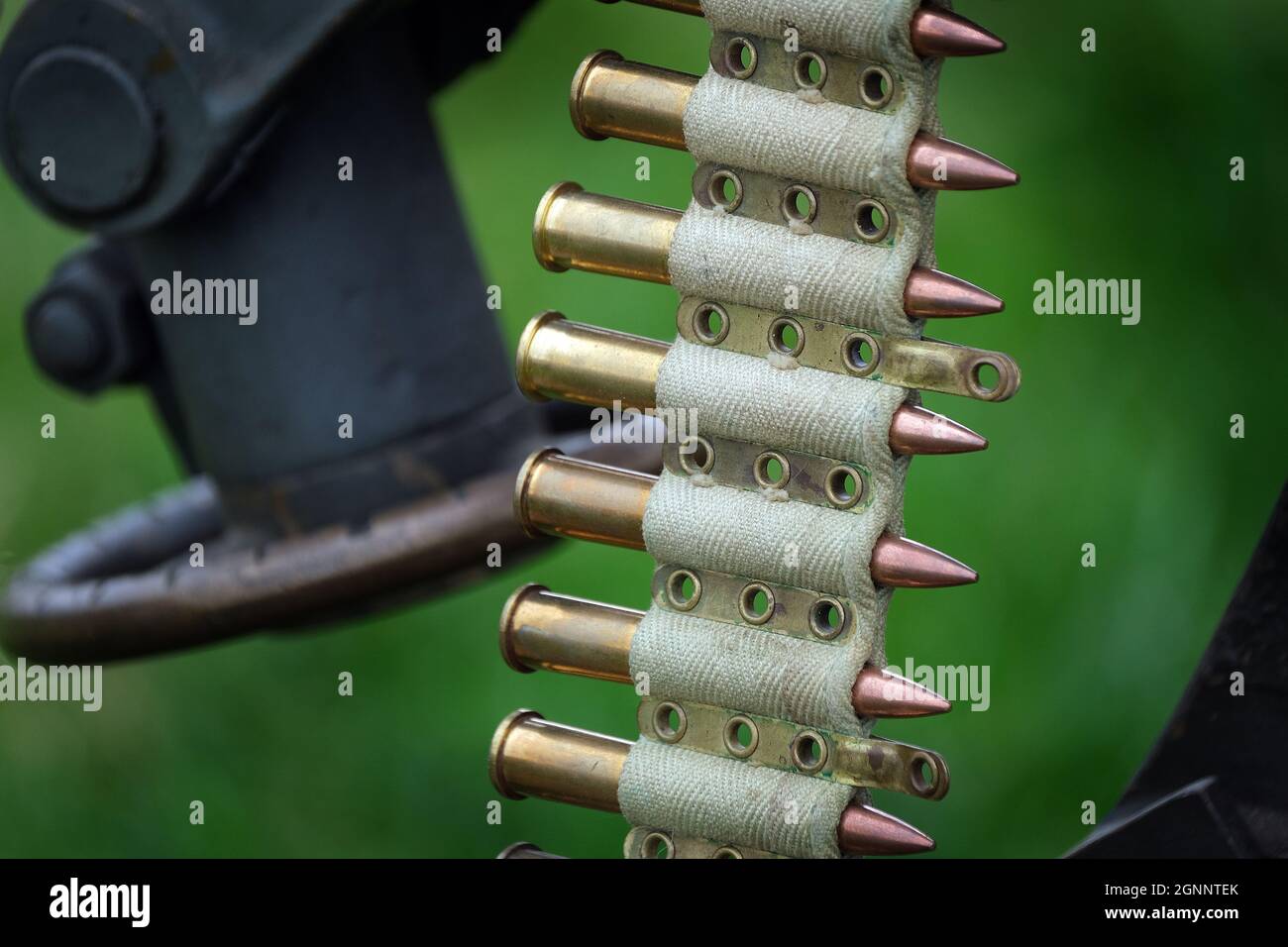 Belt of machine gun ammunition ready to feed to weapon Stock Photo - Alamy