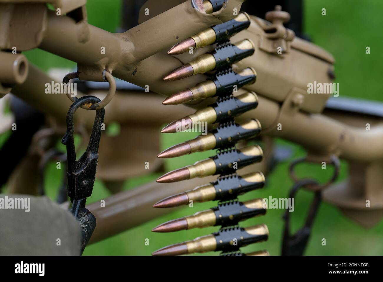 Belt of machine gun ammunition ready to feed to weapon Stock Photo - Alamy
