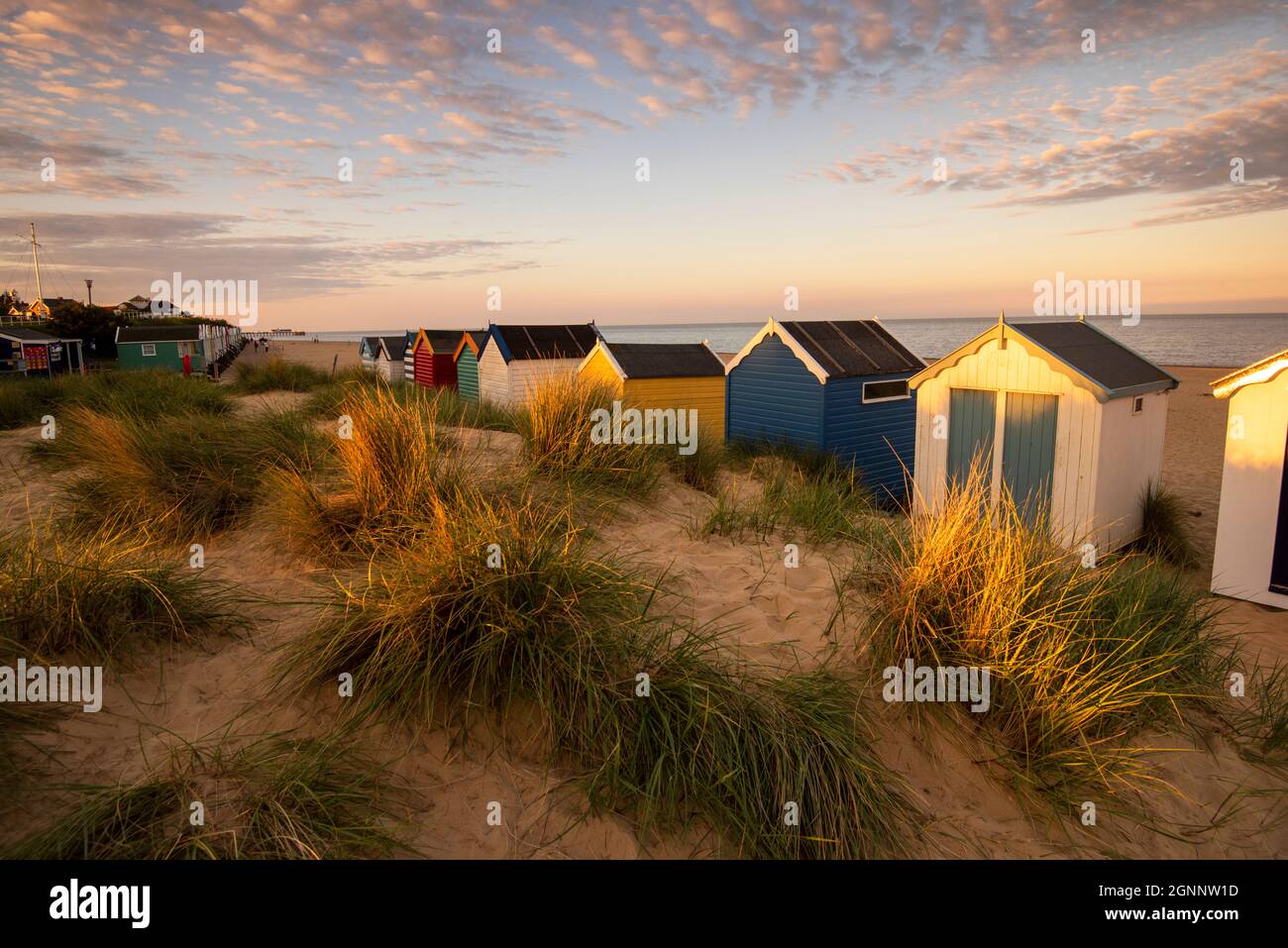 Sunset over the beach huts at Southwold, Suffolk England UK Stock Photo ...