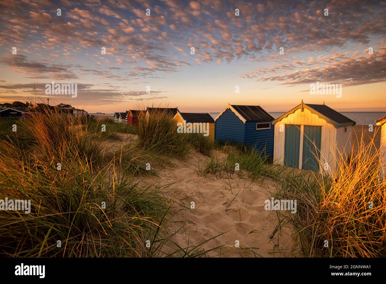 Sunset over the beach huts at Southwold, Suffolk England UK Stock Photo ...