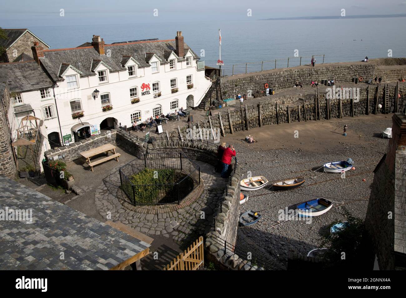 Clovelly harbour at low tide with Red Lion Hotel and two tier wharf ...