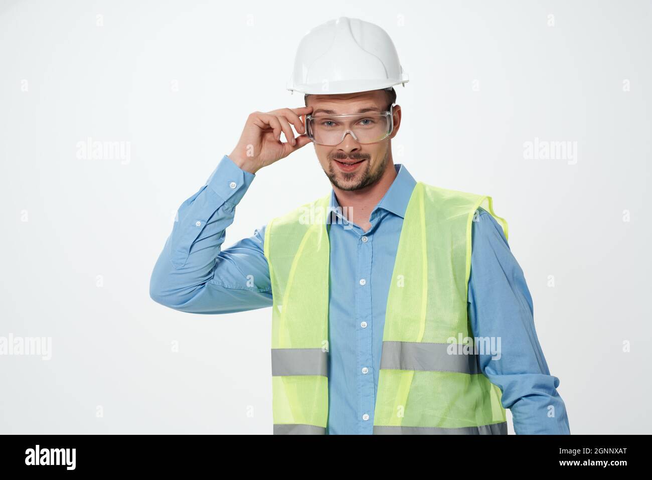 man in white helmet engineer light background Stock Photo - Alamy