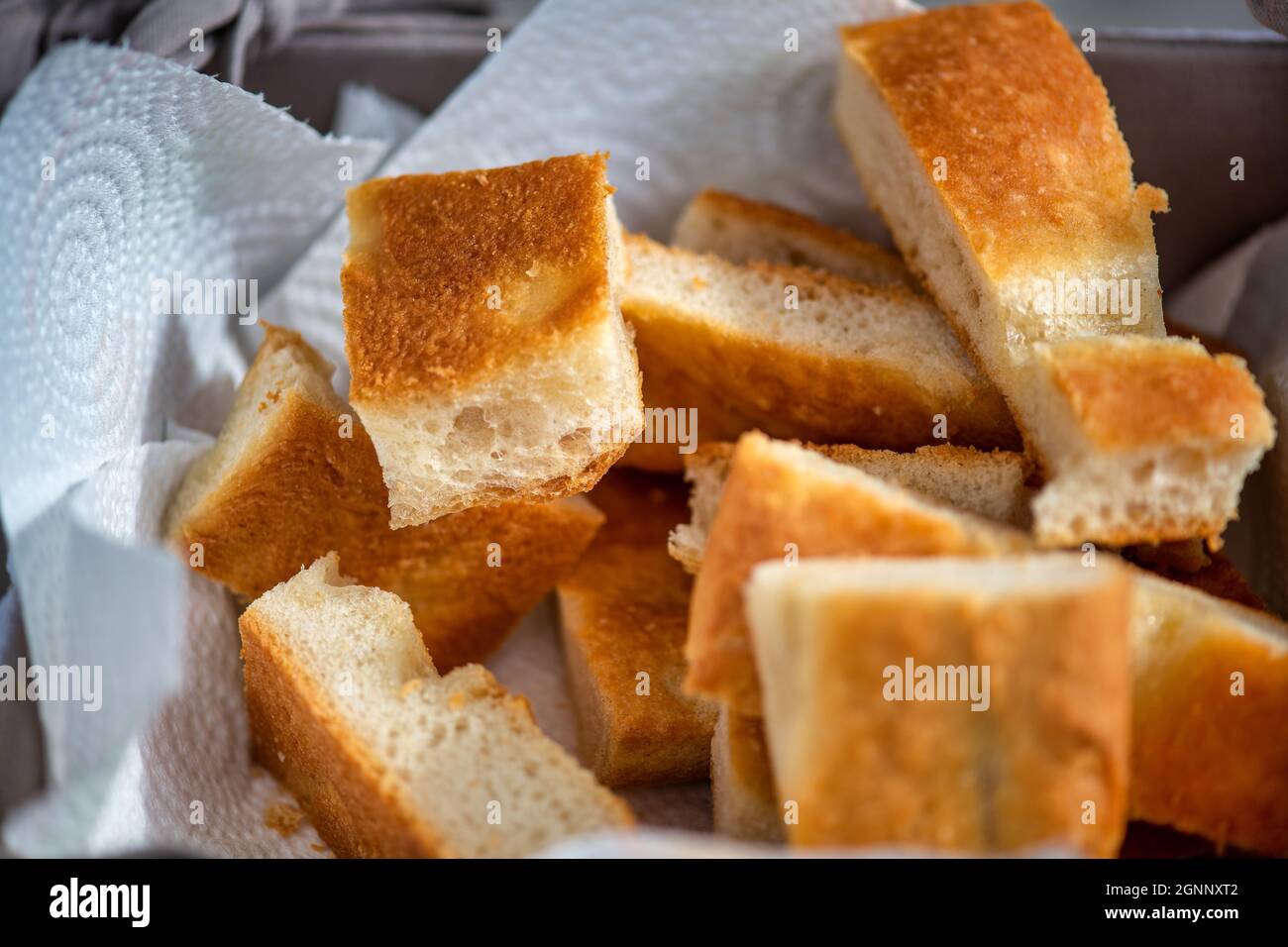 Small pieces of salted bread in a tray Stock Photo - Alamy