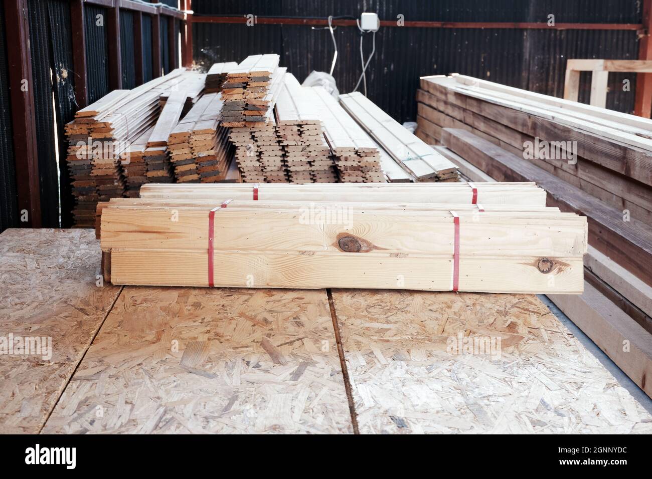 Wooden planks on chipboard plates in a lumber industry warehouse Stock ...