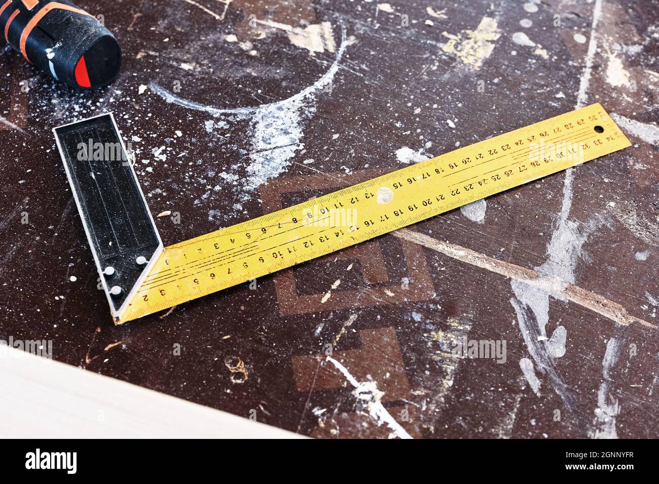 Old dirty yellow carpenter ruler on a carpentry workbench Stock Photo ...